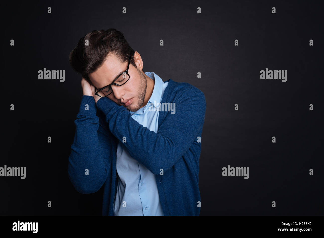 Tired young man sleeping Stock Photo - Alamy