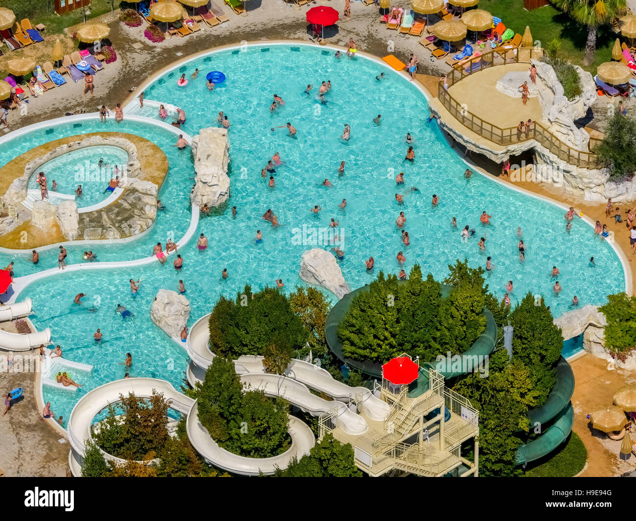 Aerial, Swimming pool with sun terrace sunshades, camping guests ...