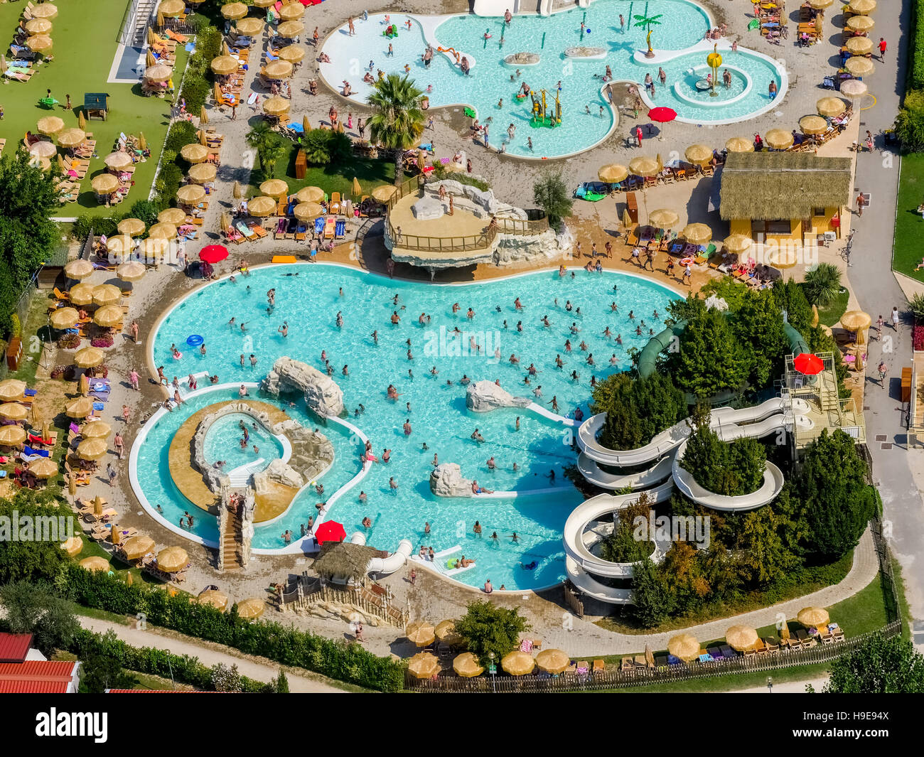 Aerial, Swimming pool with sun terrace sunshades, camping guests ...