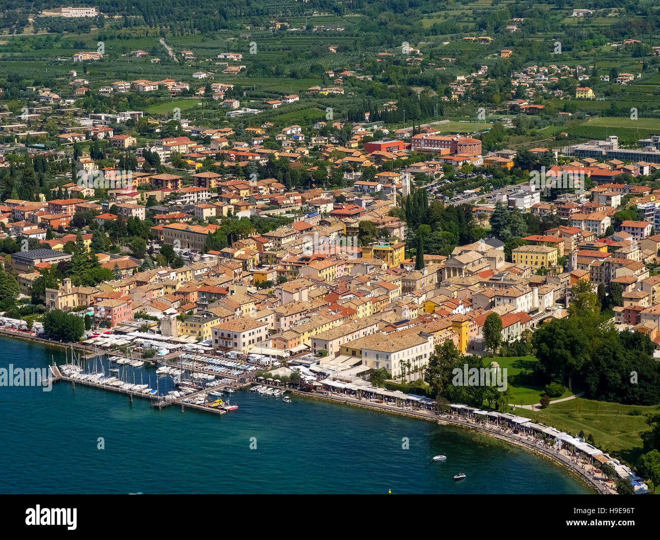 Aerial view, Bardolino with sailboats, esplanade, marina, town center ...
