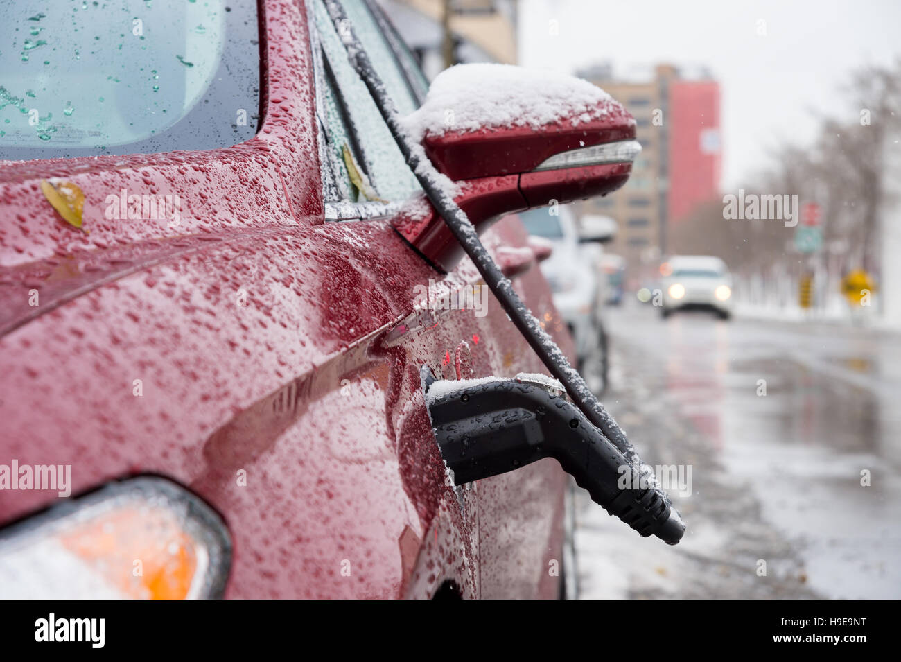 A red electric car charging in Montreal, Canada Stock Photo - Alamy