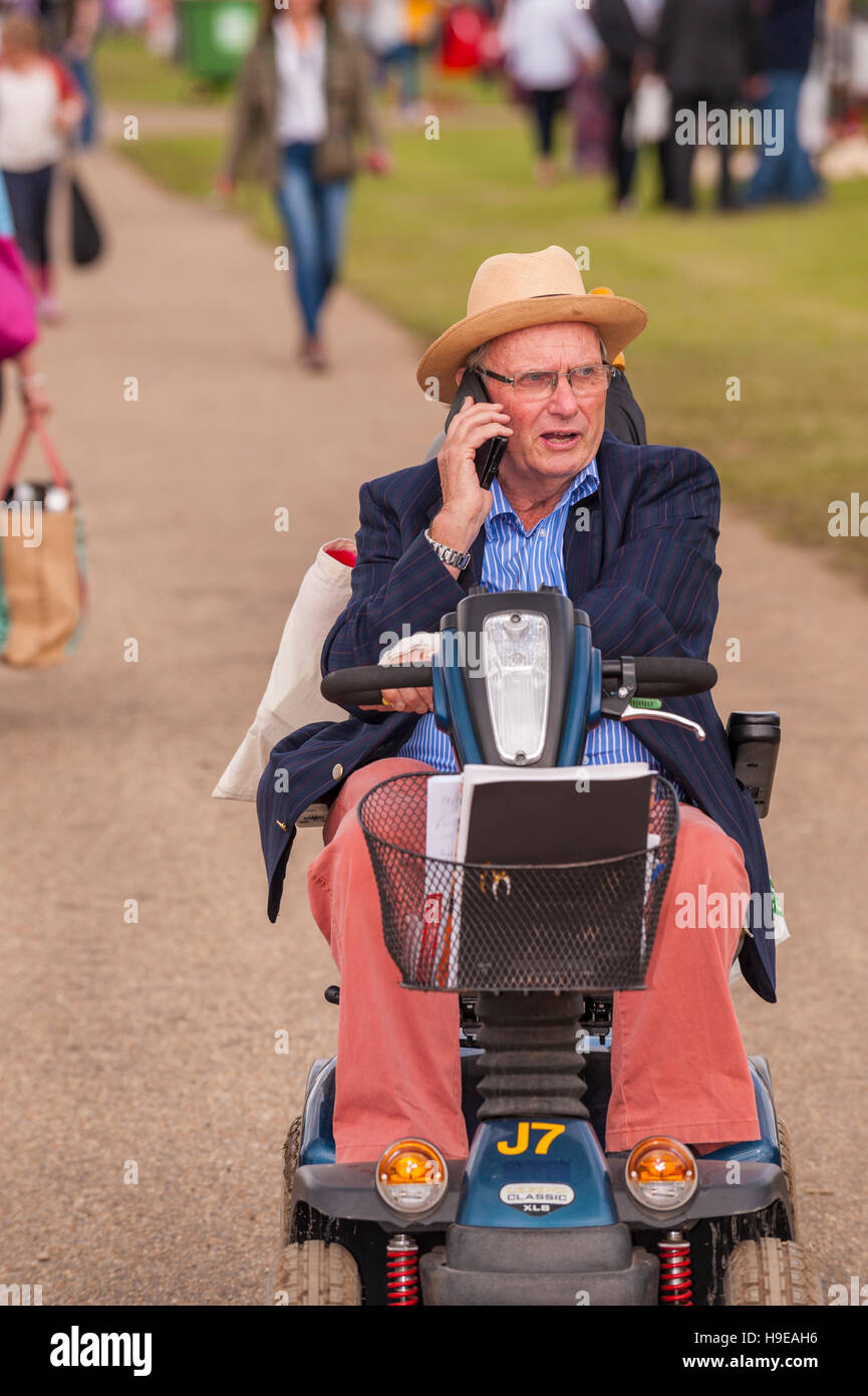 Old man in mobility scooter hi-res stock photography and images - Alamy