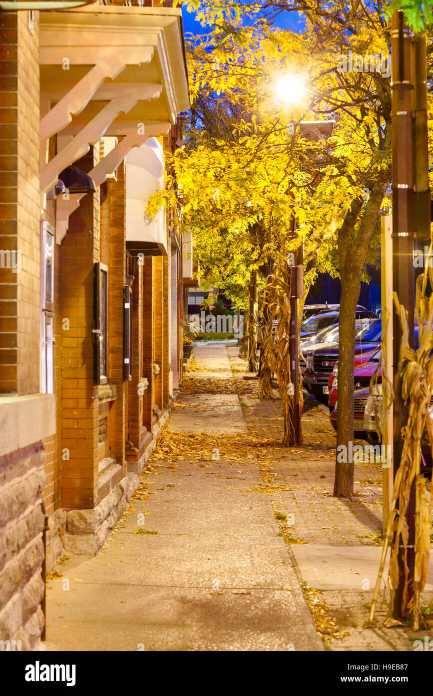 A view of a sidewalk at dusk in downtown Paris, Brant County, Ontario ...