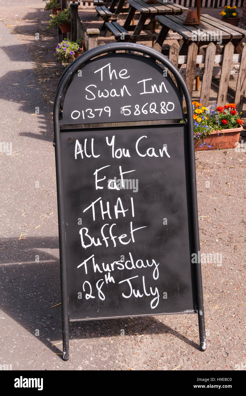 A menu board outside the Swan Freehouse in Fressingfield , Suffolk ...