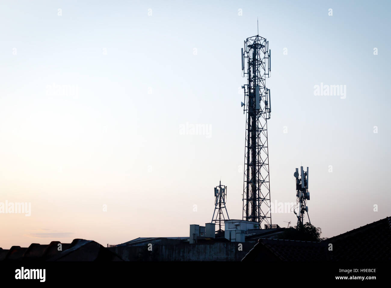 Radio telecommunication infrastructure towers on the roof top of a ...