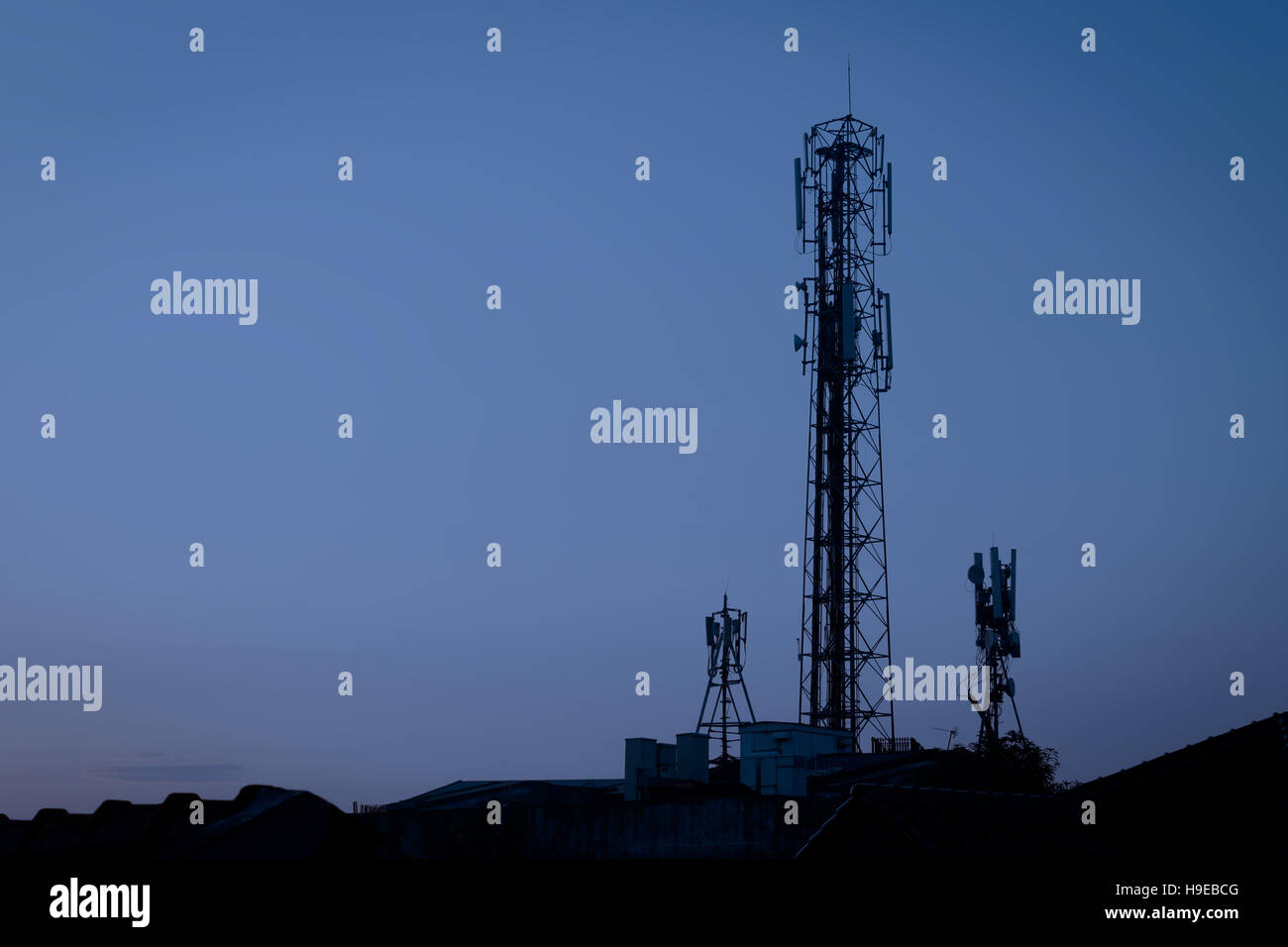 Radio telecommunication infrastructure towers on the roof top of a ...