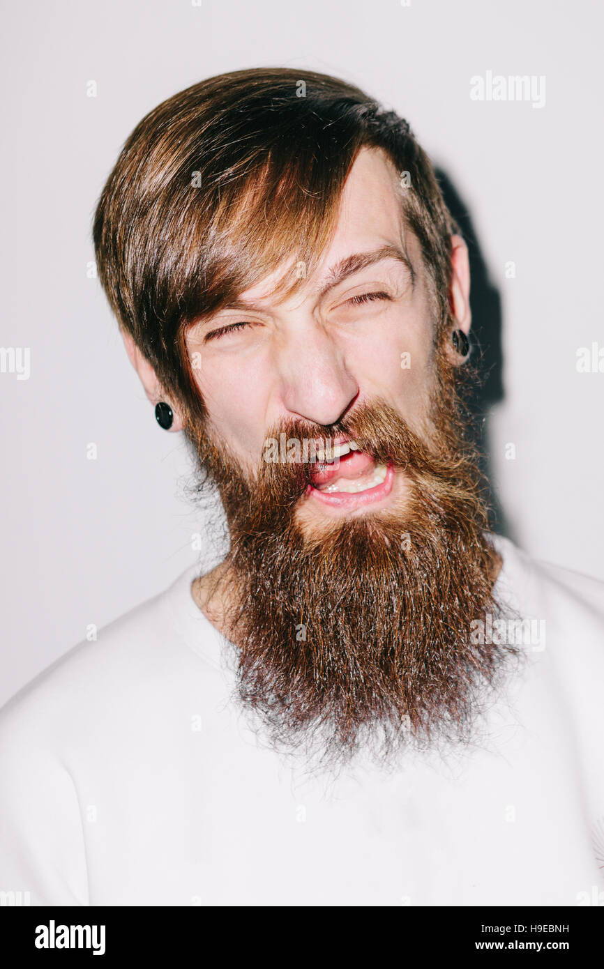 Bearded man making a face Stock Photo - Alamy