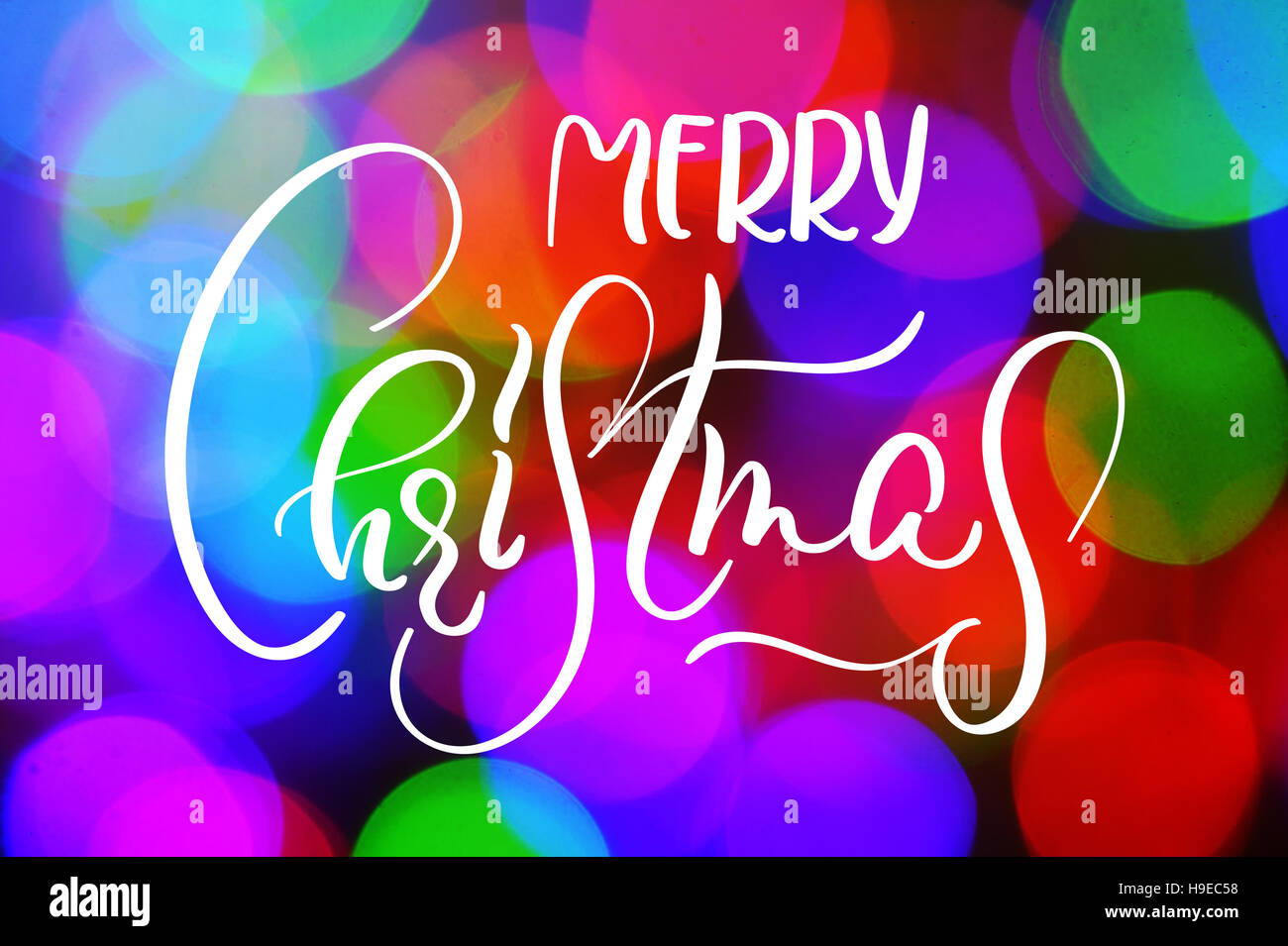 Colorful bokeh background with words Merry Christmas. Calligraphy ...