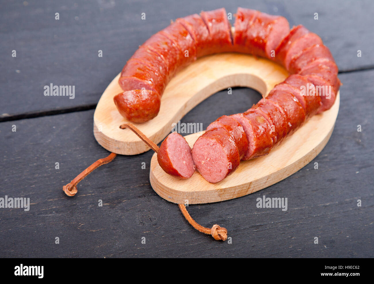 Traditional Dutch smoked sausage called Rookworst on wooden background ...