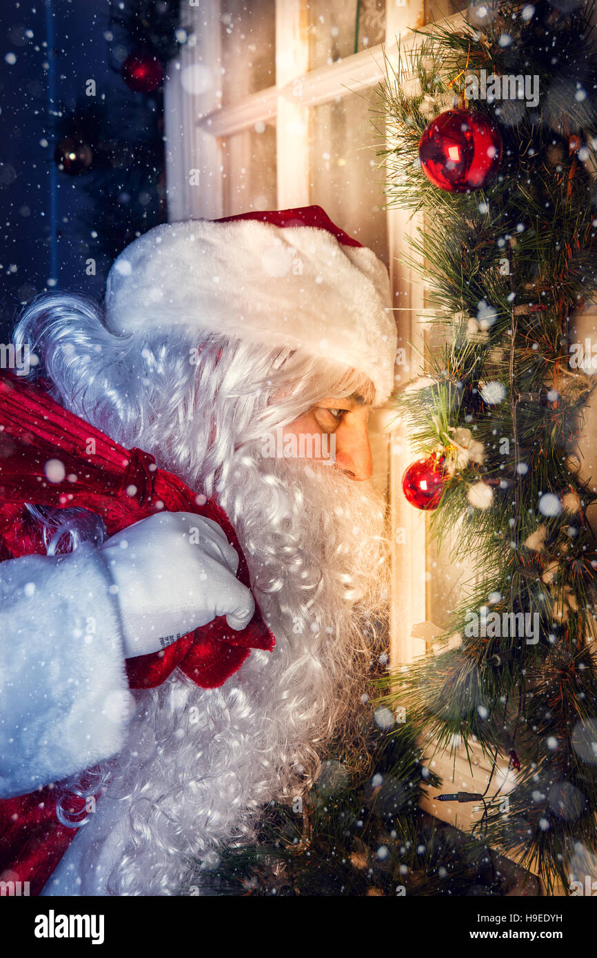 Portrait of Santa Claus. Santa Claus looks out the window Stock Photo ...