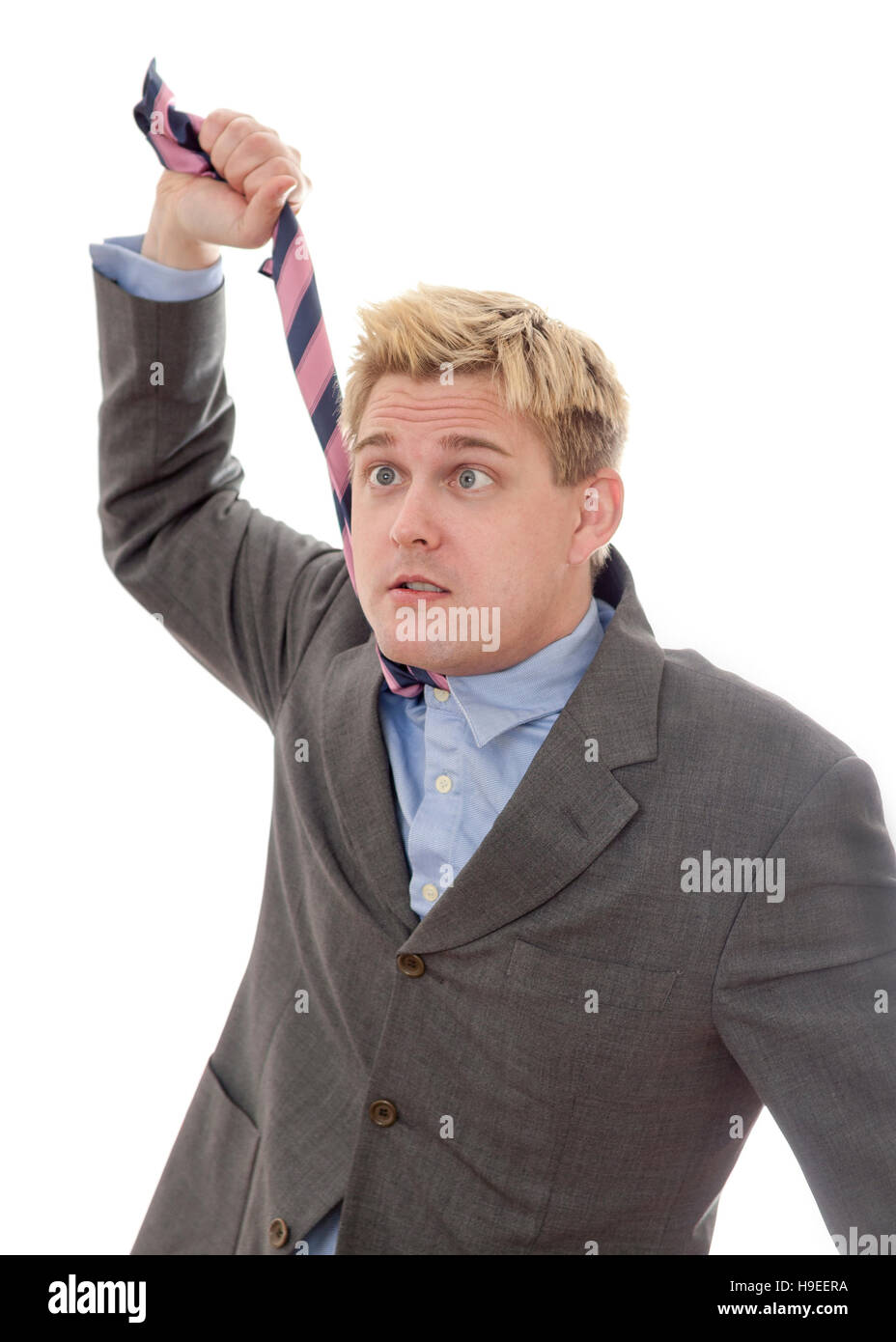 Crazy businessman gone mad strangling himself with his necktie isolated ...