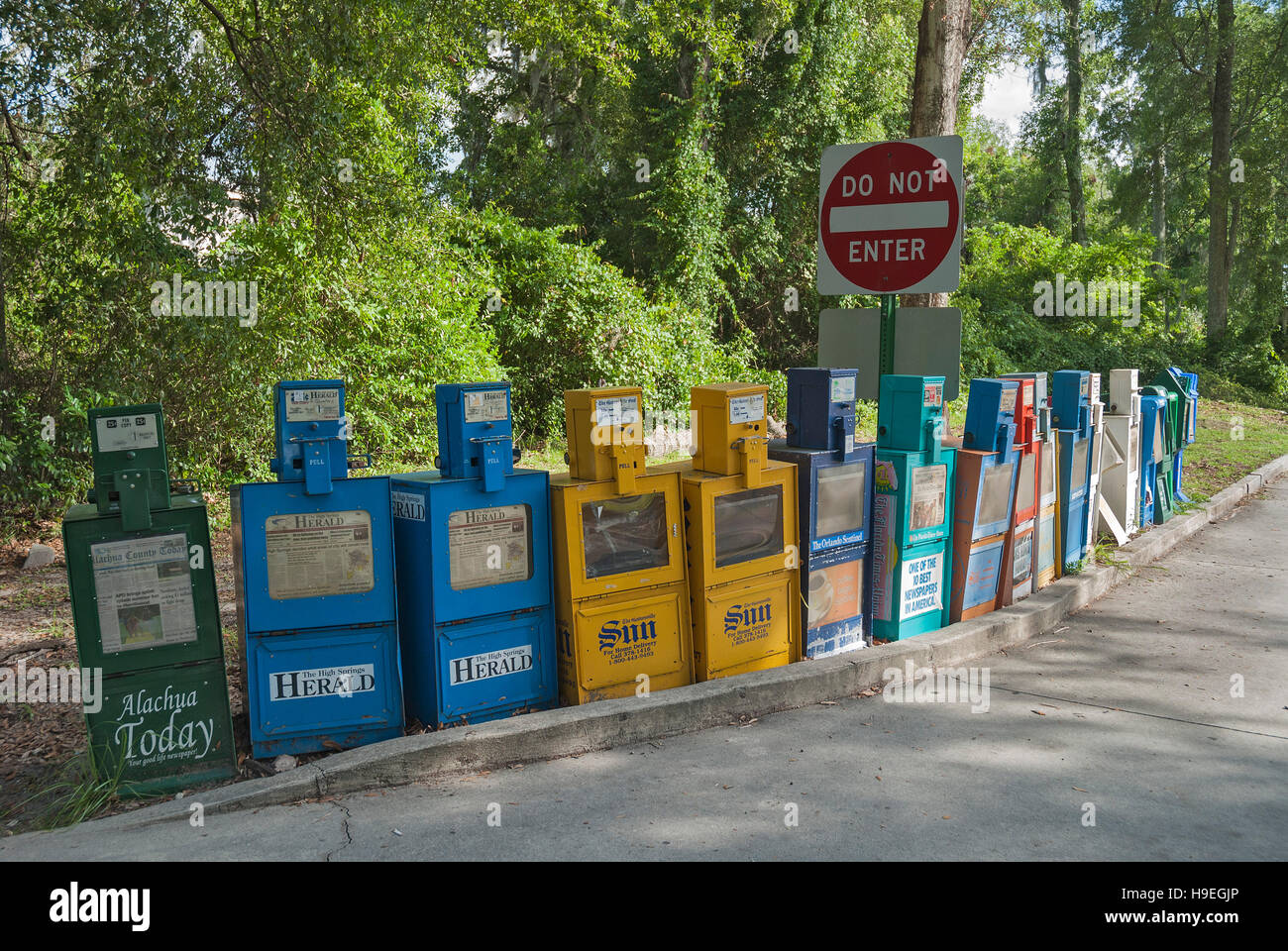 Newspaper boxes lined up outside a Post Office Stock Photo - Alamy
