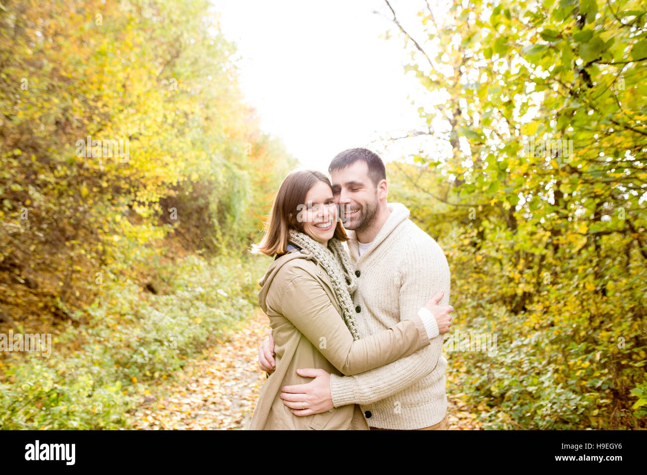 Beautiful young couple on a walk in colorful autumn nature Stock Photo ...