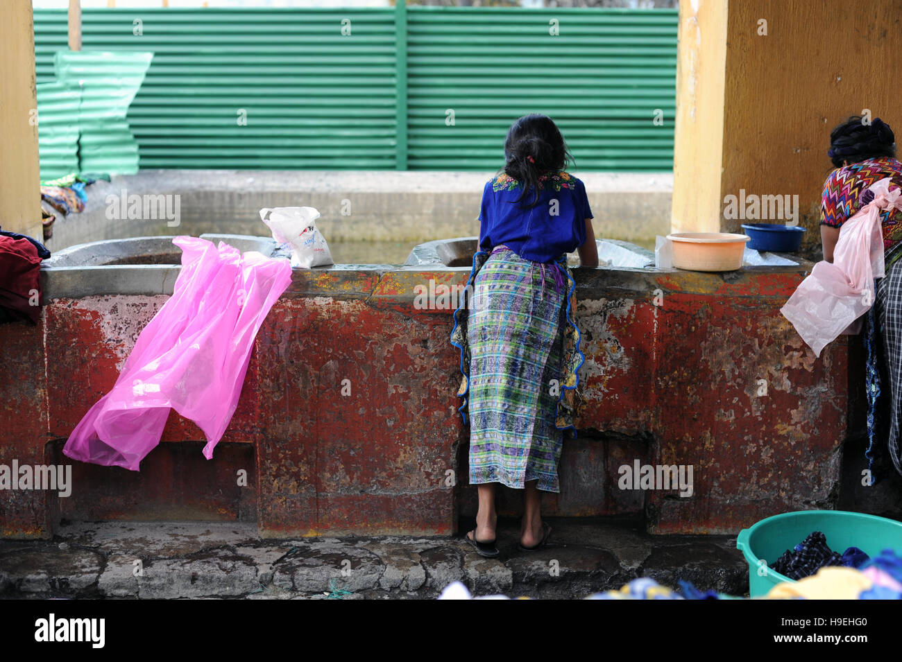Maya indigenous women wash laundry at the Public Pila of Antigua ...