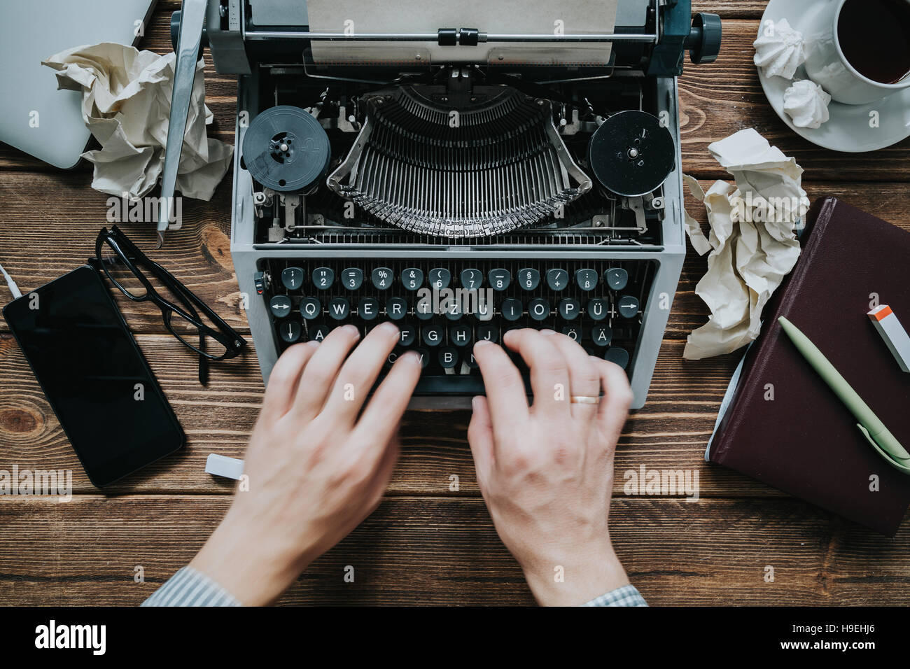 Writer typing with retro writing machine Stock Photo - Alamy