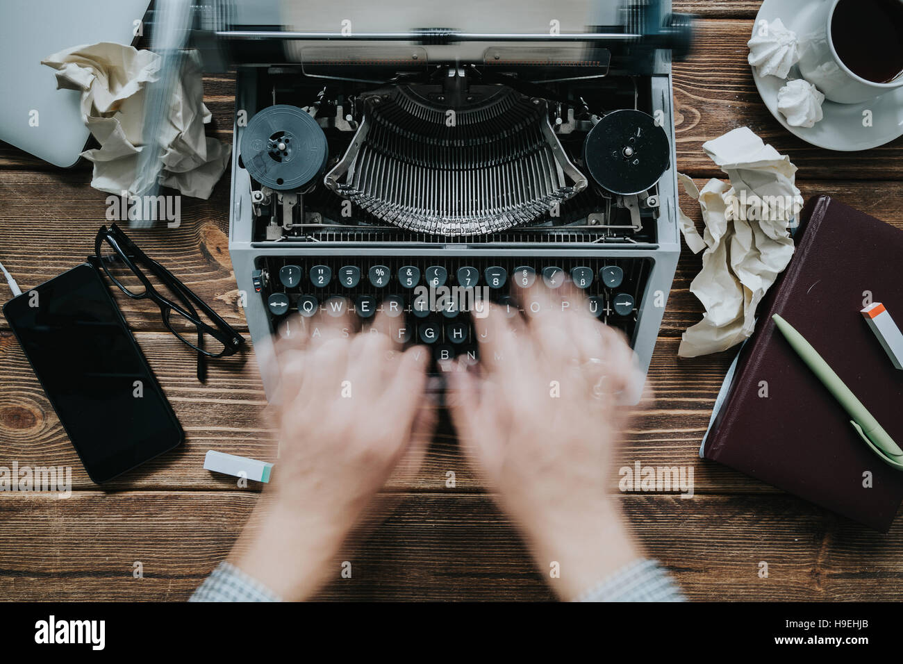Writer typing with retro writing machine Stock Photo - Alamy