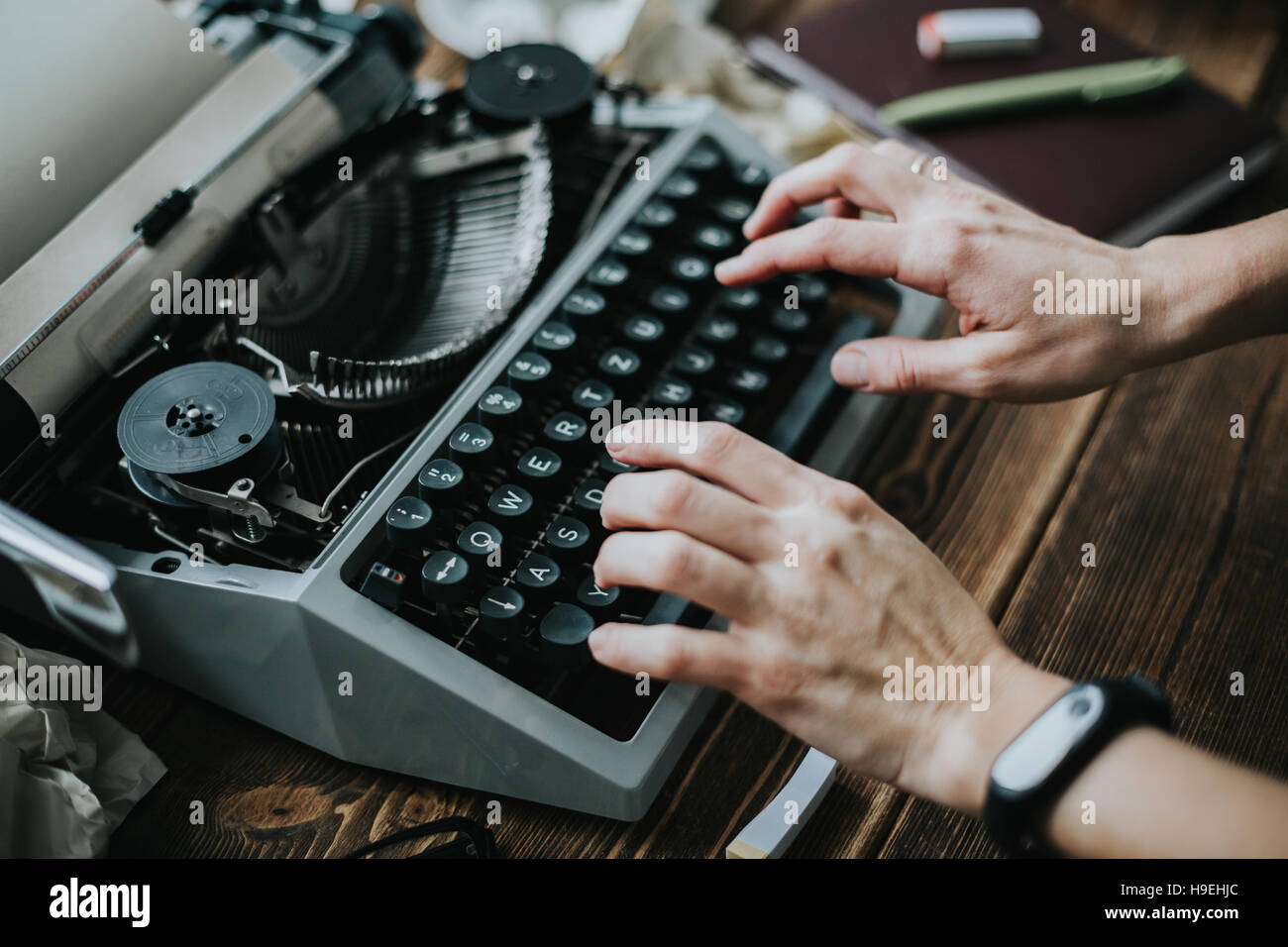 Writer typing with retro writing machine Stock Photo - Alamy
