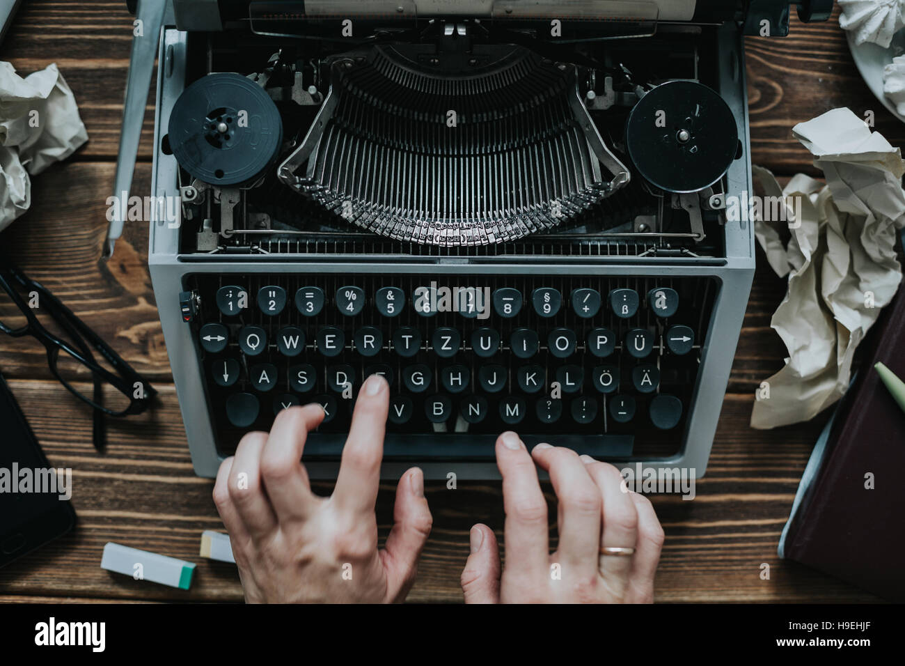 Writer typing with retro writing machine Stock Photo - Alamy