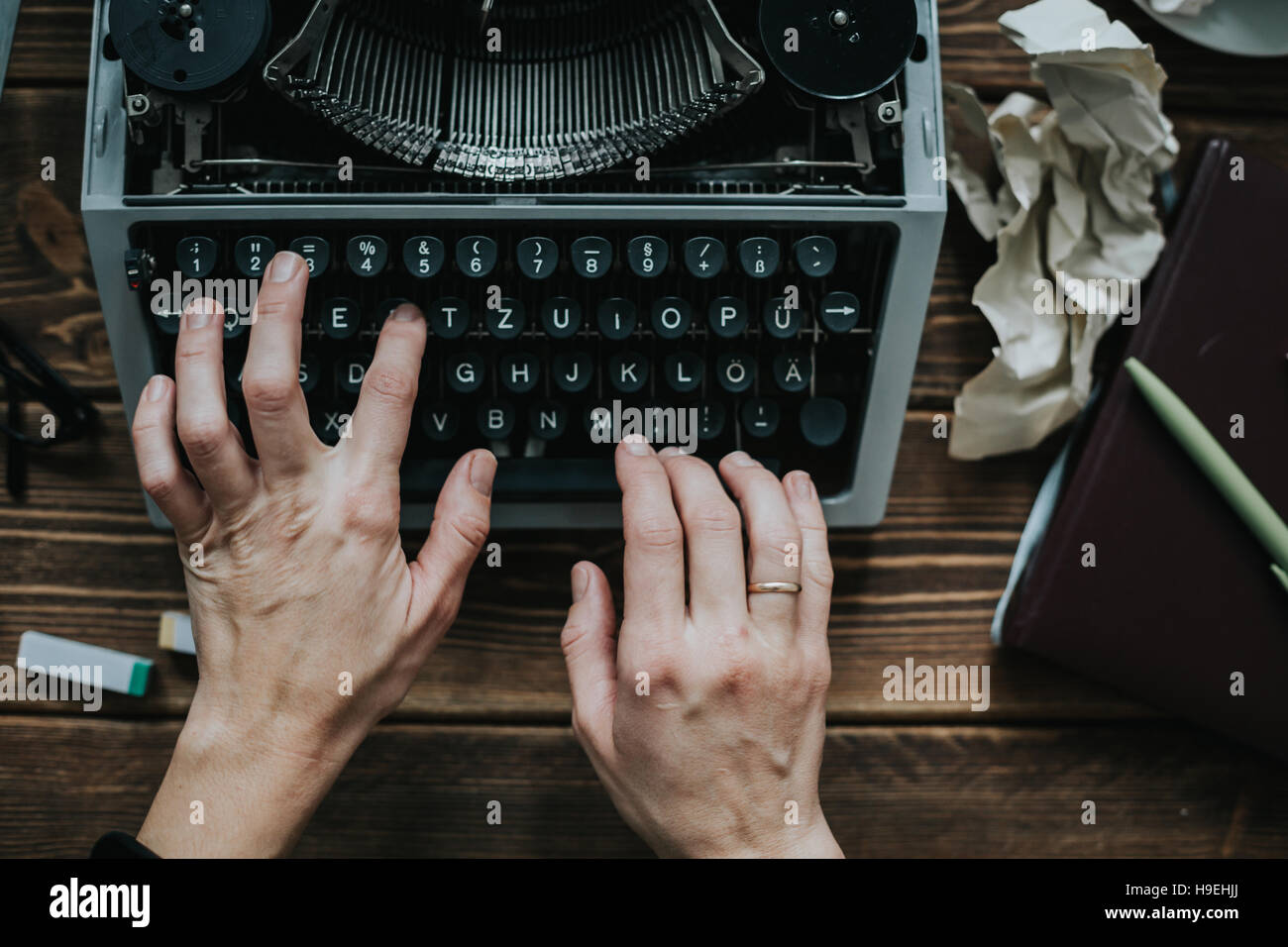 Writer typing with retro writing machine Stock Photo - Alamy