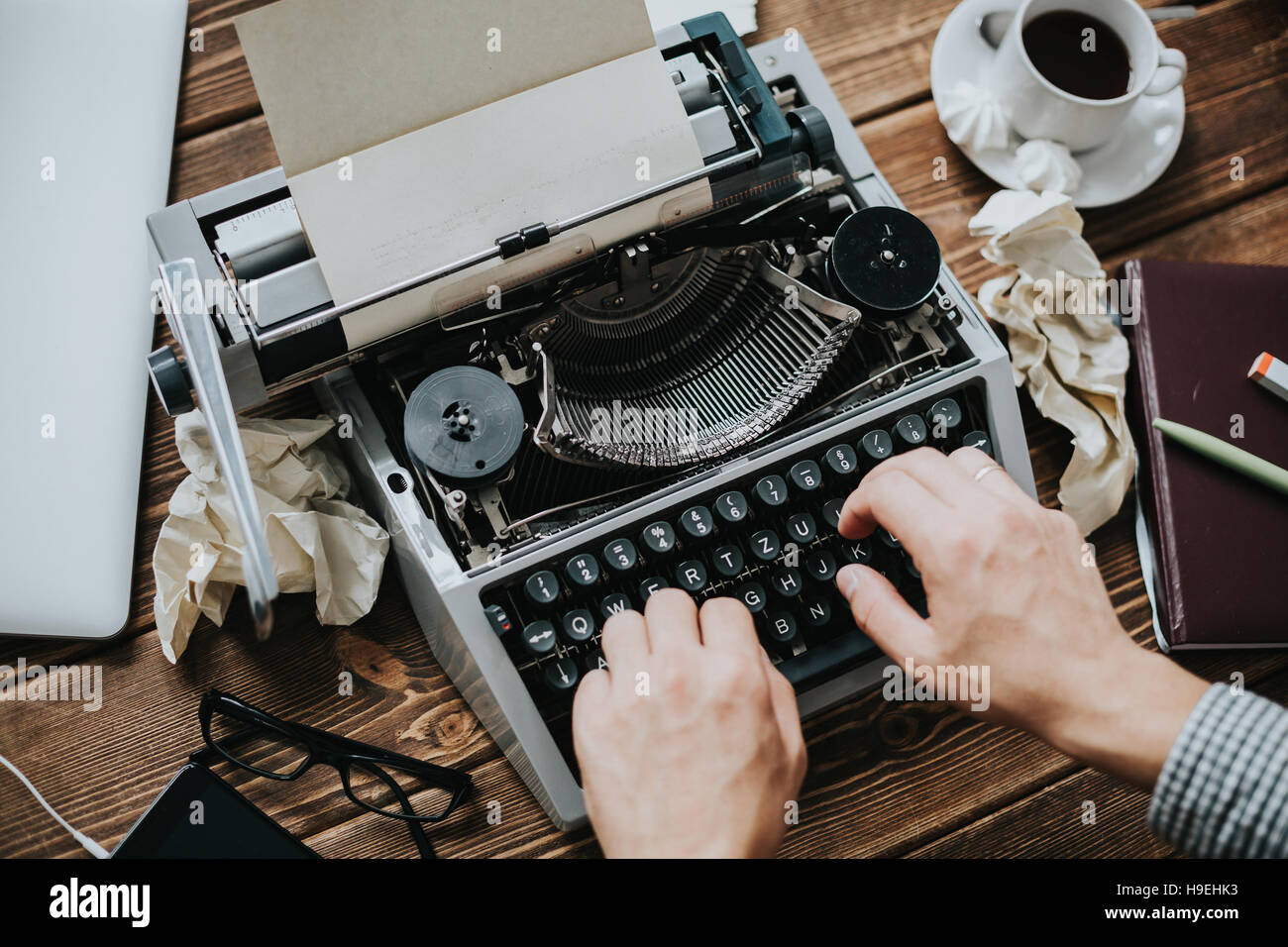 Writer typing with retro writing machine Stock Photo - Alamy