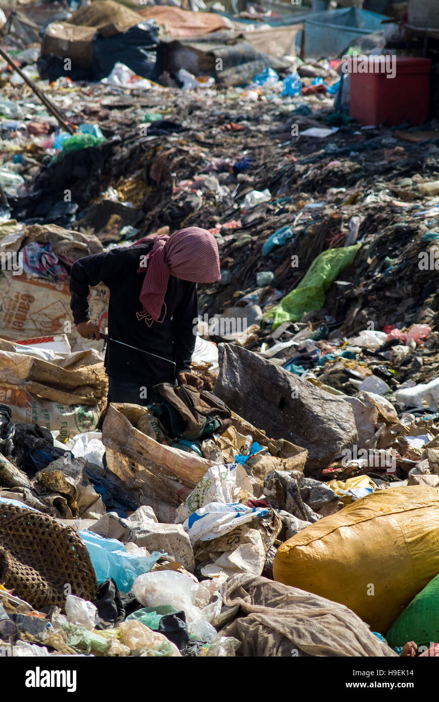 A scavenger picks through rubbish at the former Stung Meanchey garbage ...