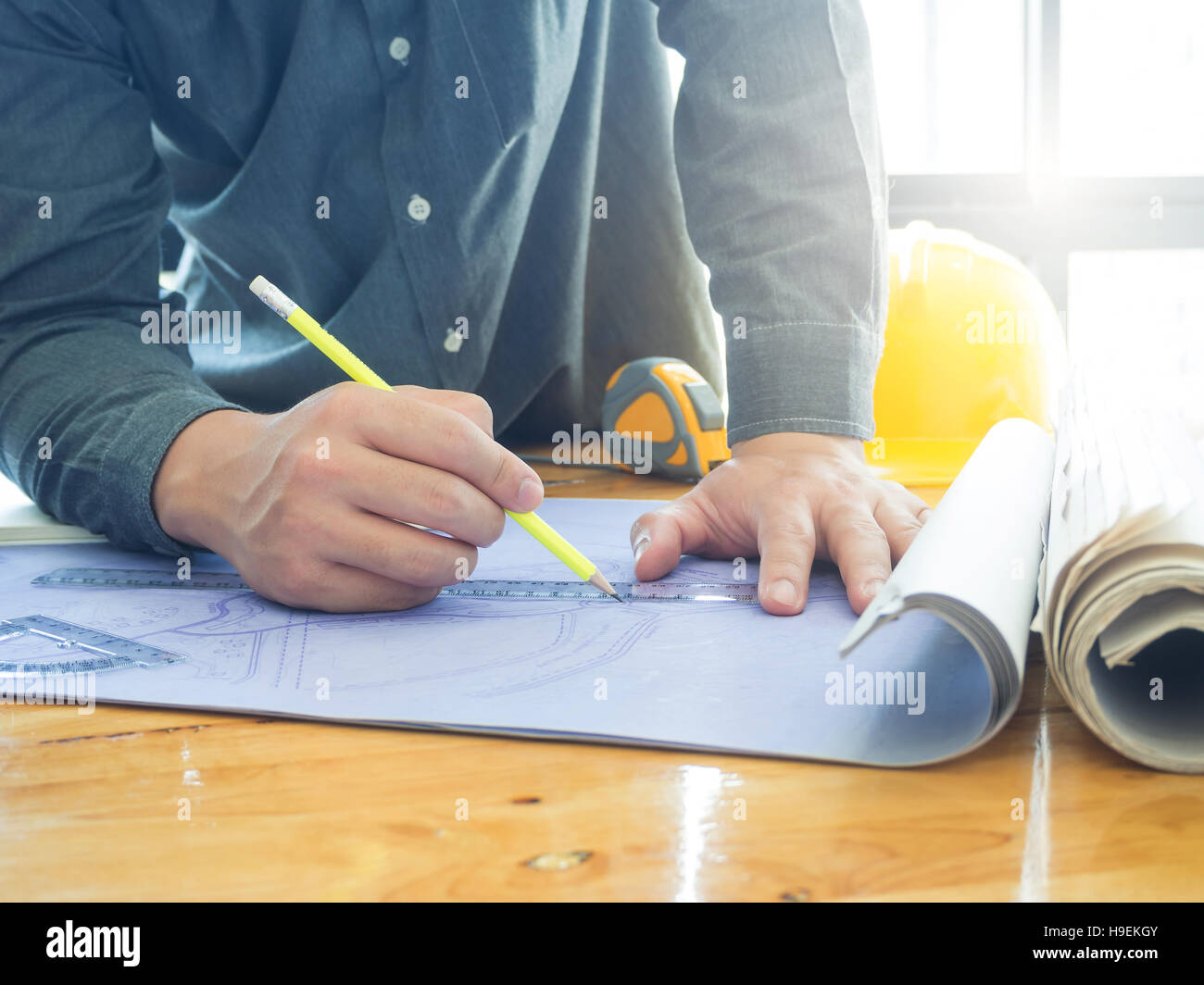 Architect concept, Architects working with blueprints in the office ...