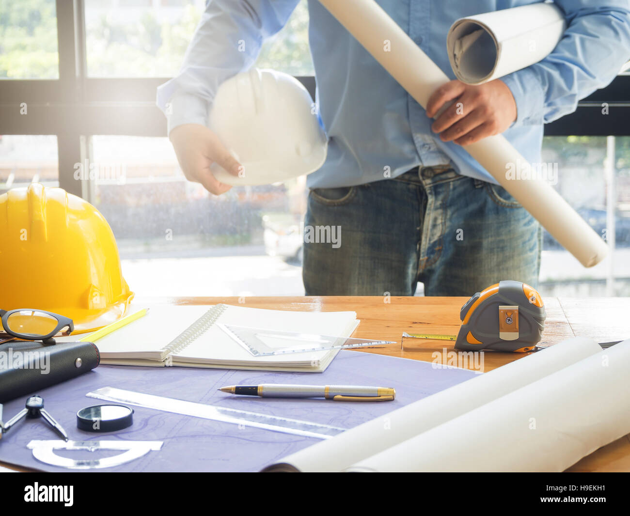 Architect concept, Architects working with blueprints in the office ...