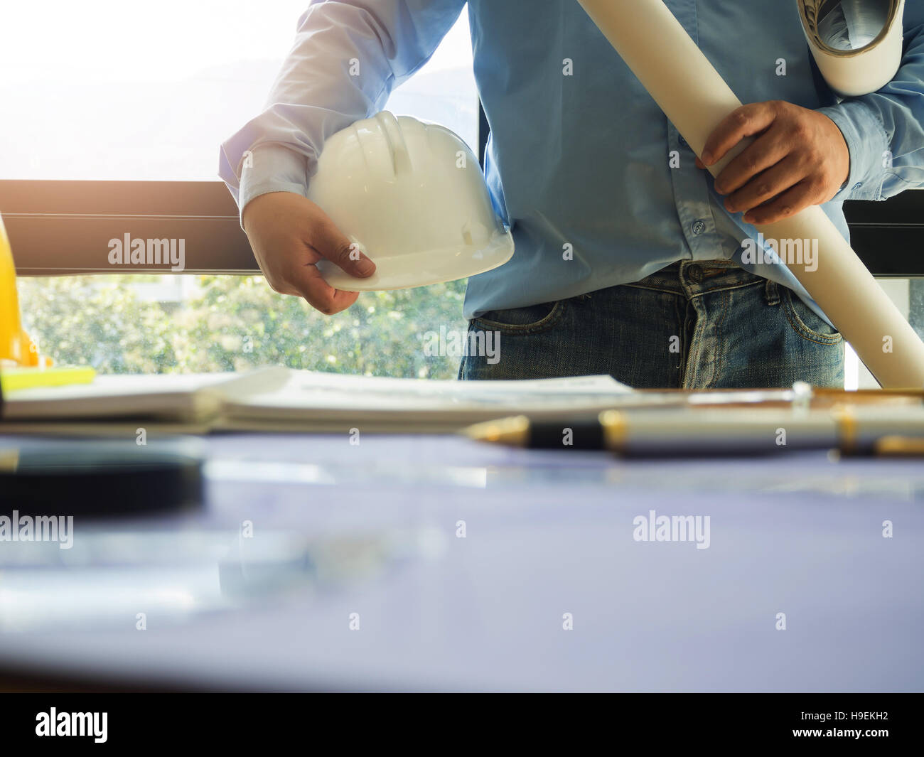 Architect concept, Architects working with blueprints in the office ...