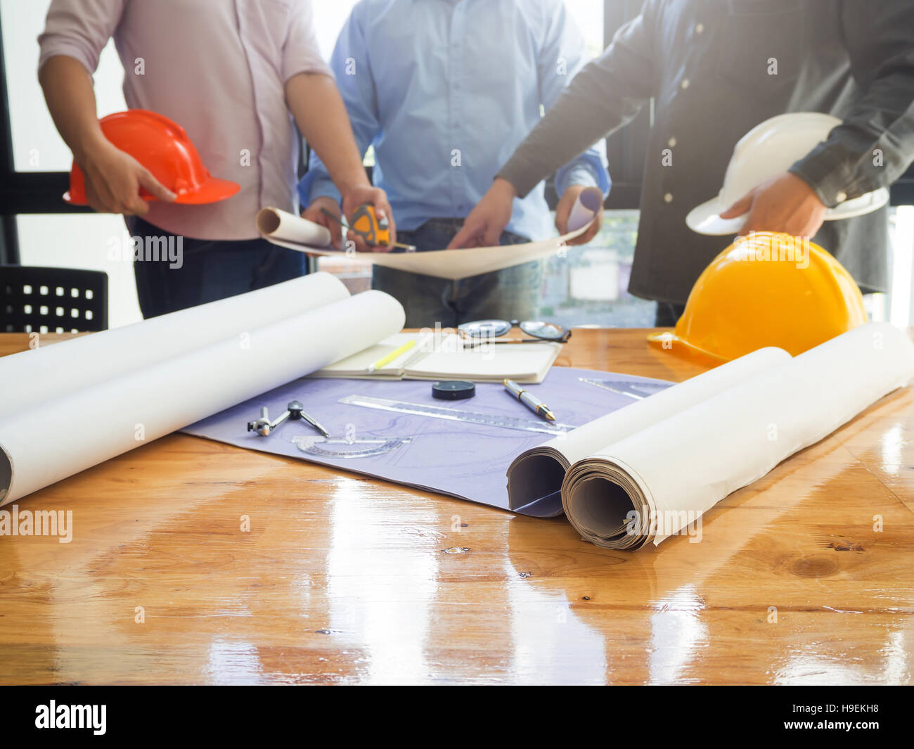 Architect concept, Architects working with blueprints in the office ...