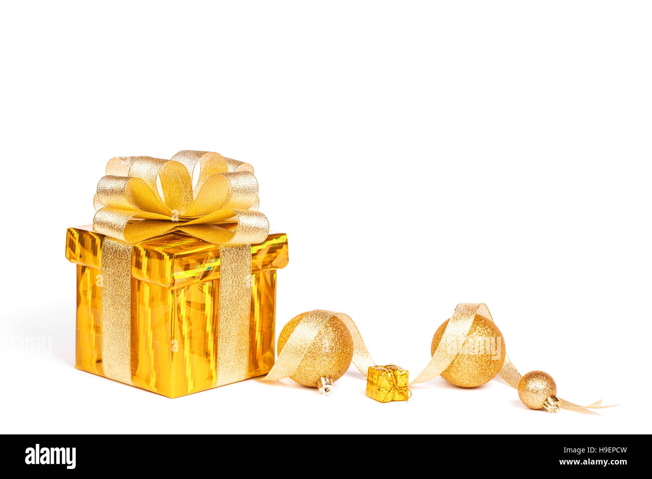 Christmas gold gift box isolated on white background. Studio shot Stock ...