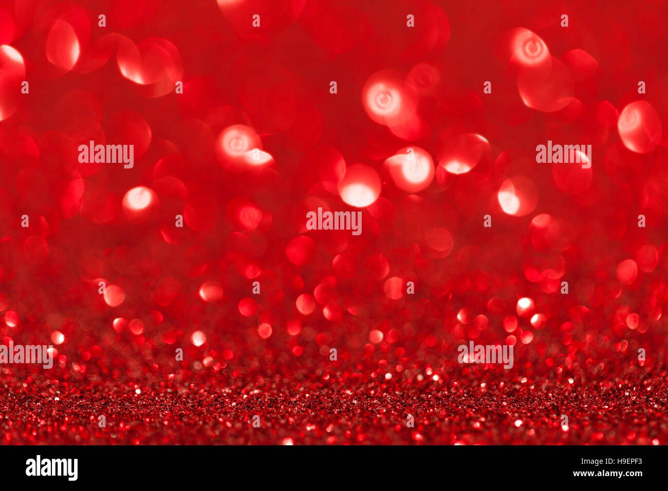 Red shiny glitter holiday christmas background Stock Photo - Alamy