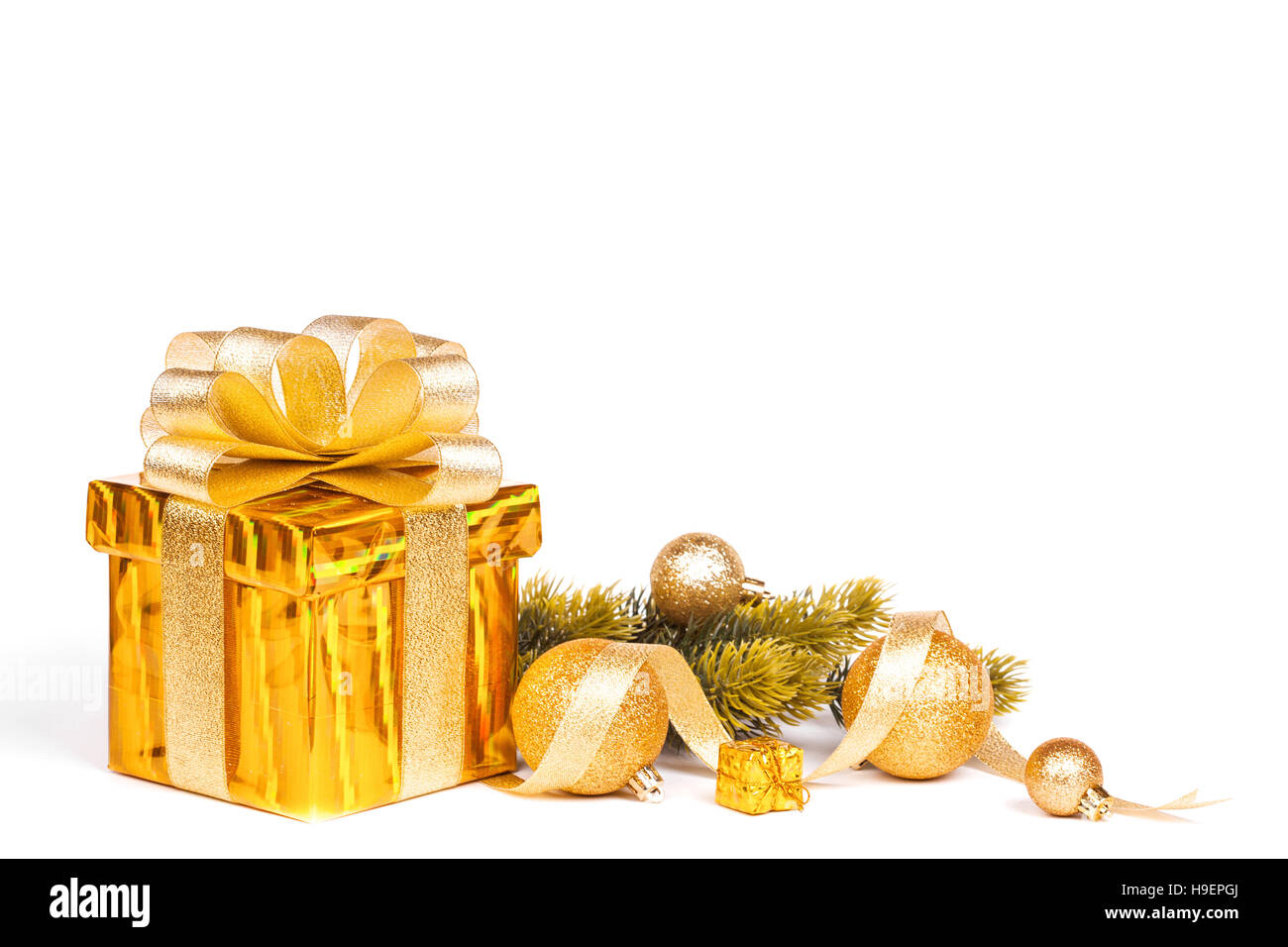 Christmas gold gift box isolated on white background Stock Photo - Alamy