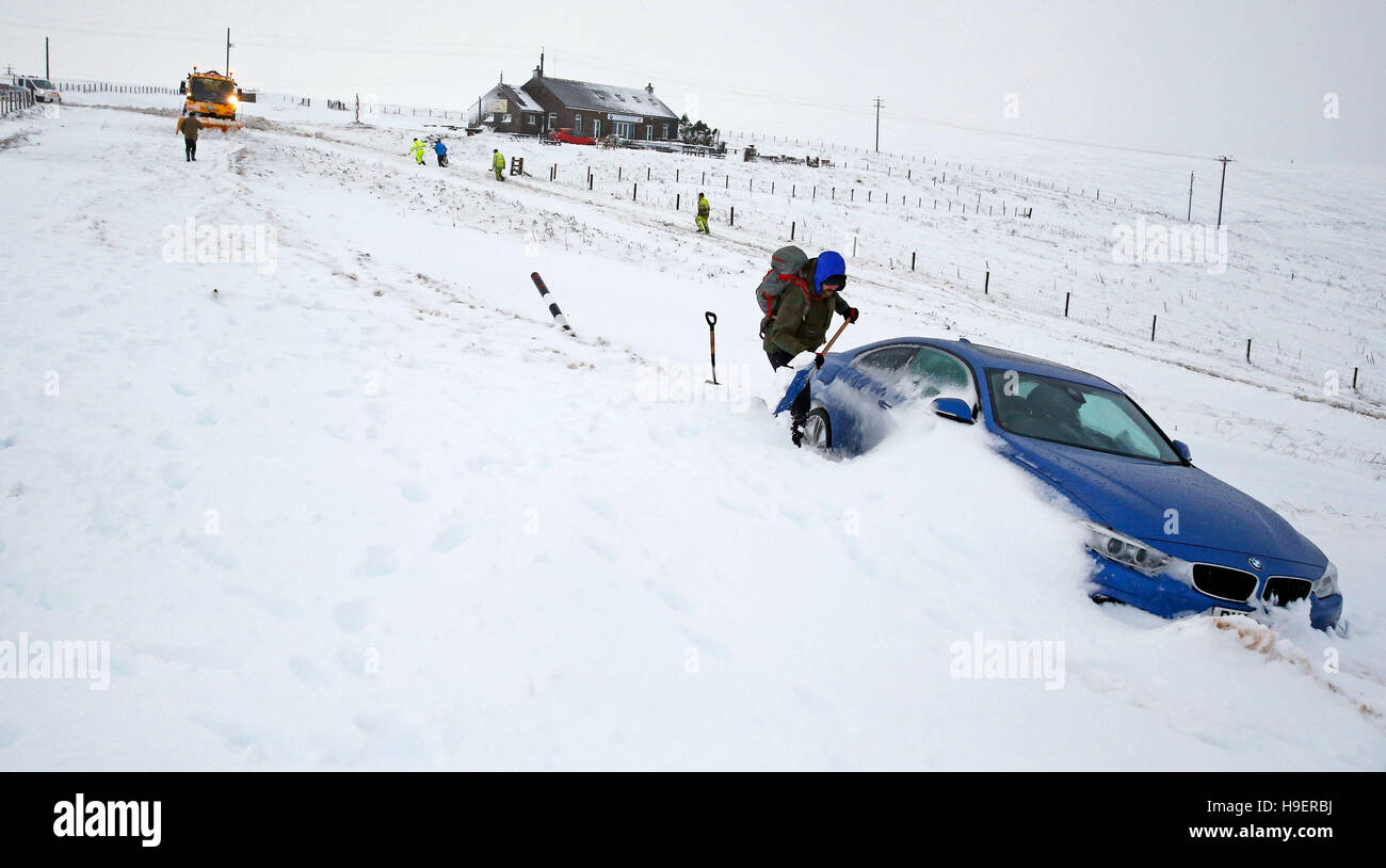 A man digs his car out from the snow on the A686 by Hartside Cafe on ...