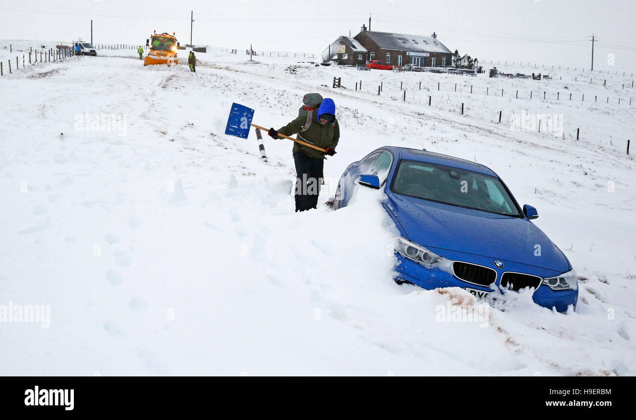 A man digs his car out from the snow on the A686 by Hartside Cafe on ...