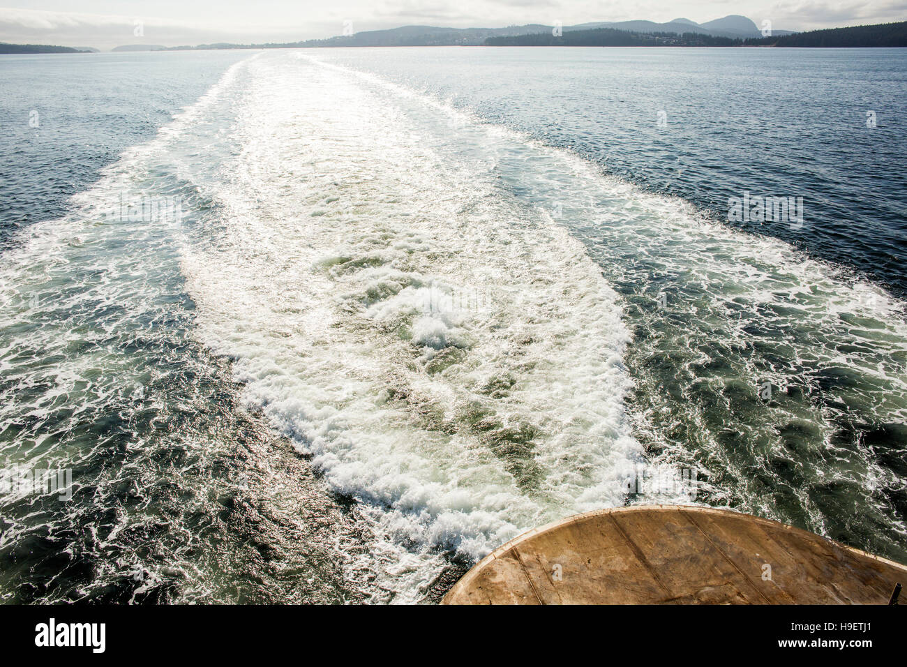 Wake from boat in water Stock Photo - Alamy