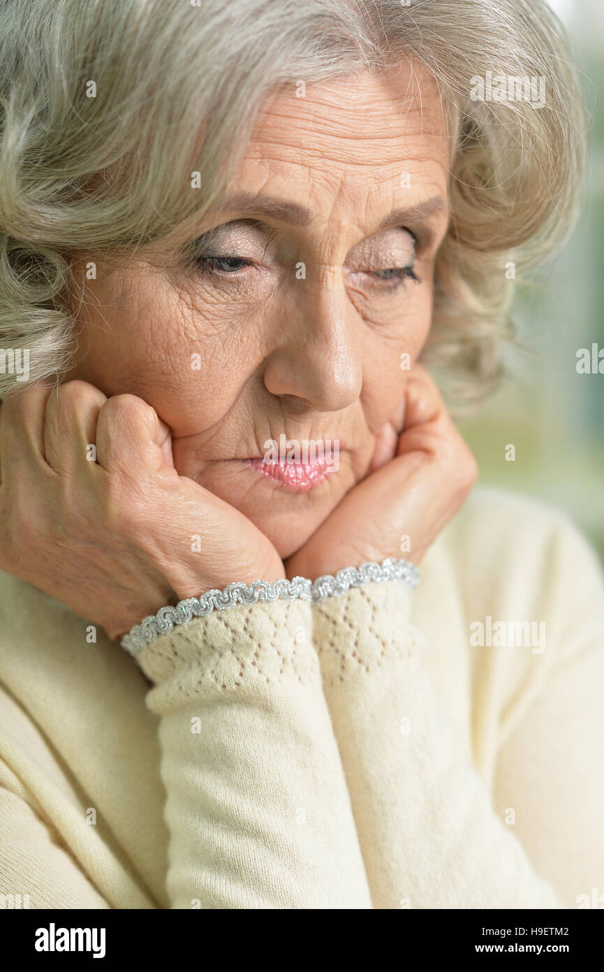 Bored senior woman Stock Photo - Alamy