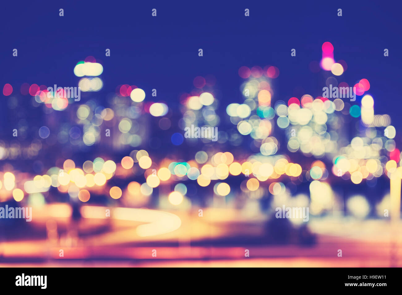 Vintage toned blurred Denver city lights at night, urban abstract ...