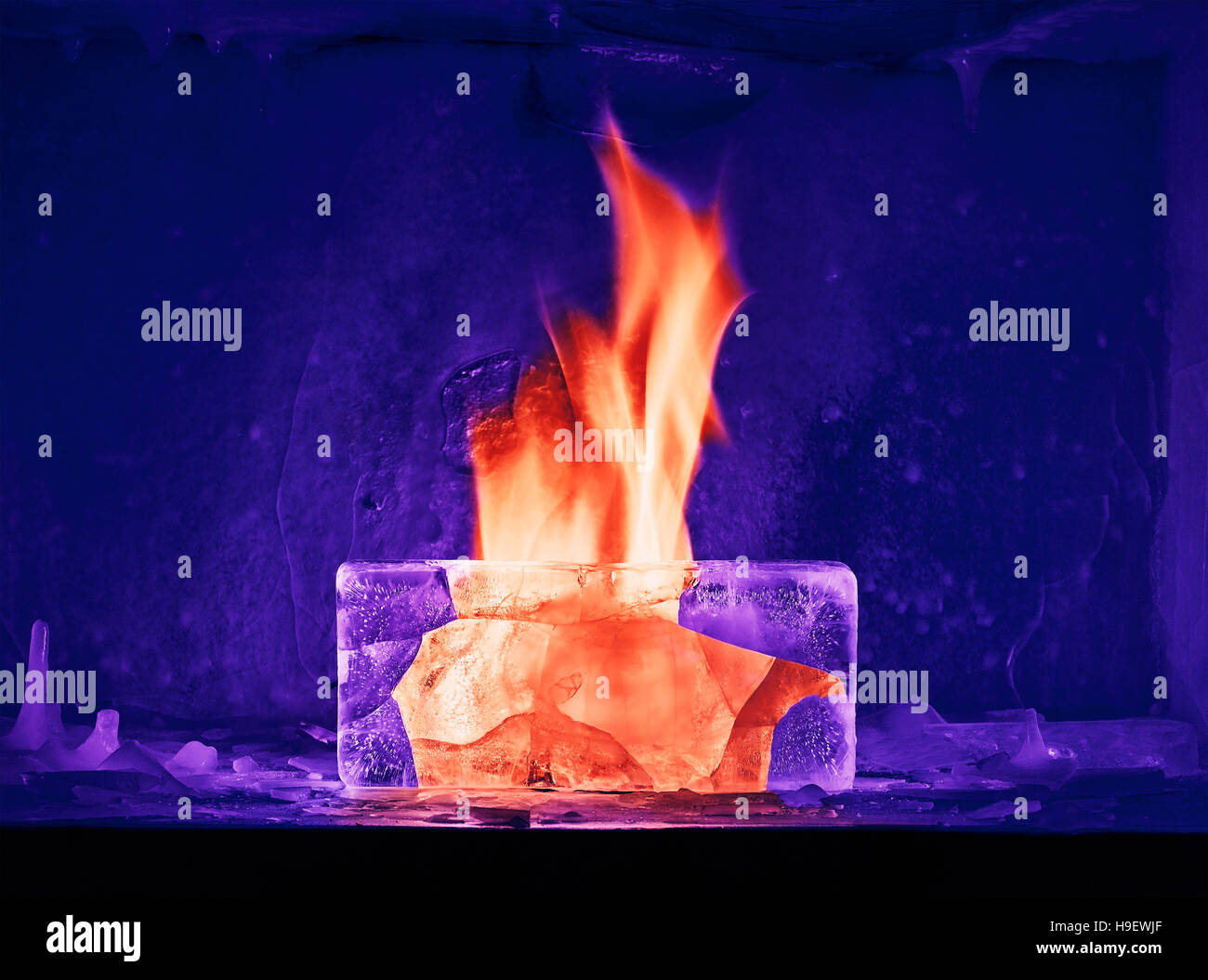Orange flame burning in purple ice Stock Photo - Alamy