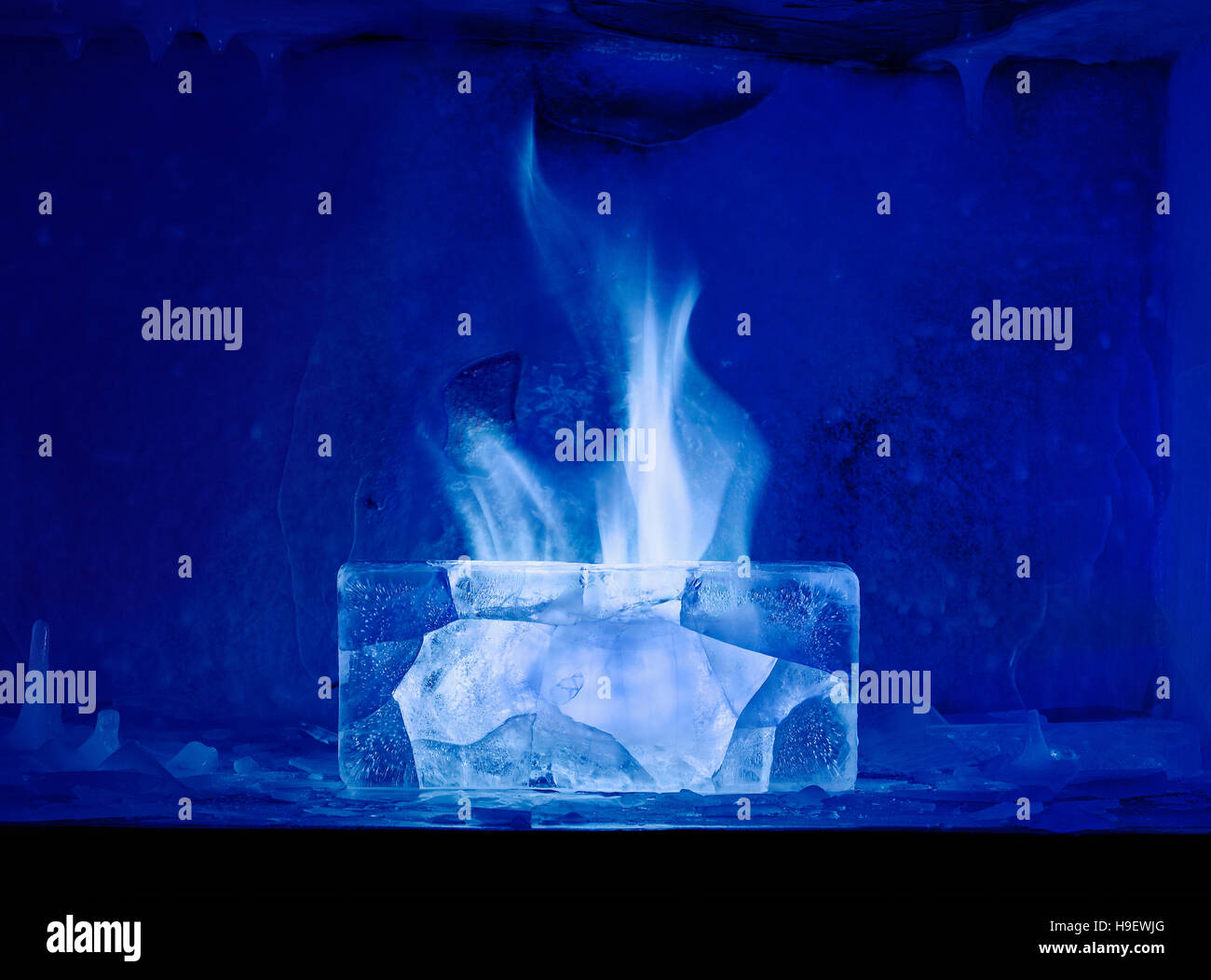 White flame burning in blue ice Stock Photo - Alamy
