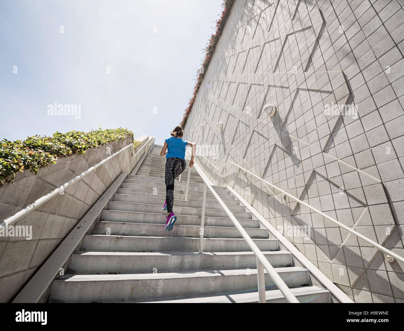 Female runner running ascending hi-res stock photography and images - Alamy