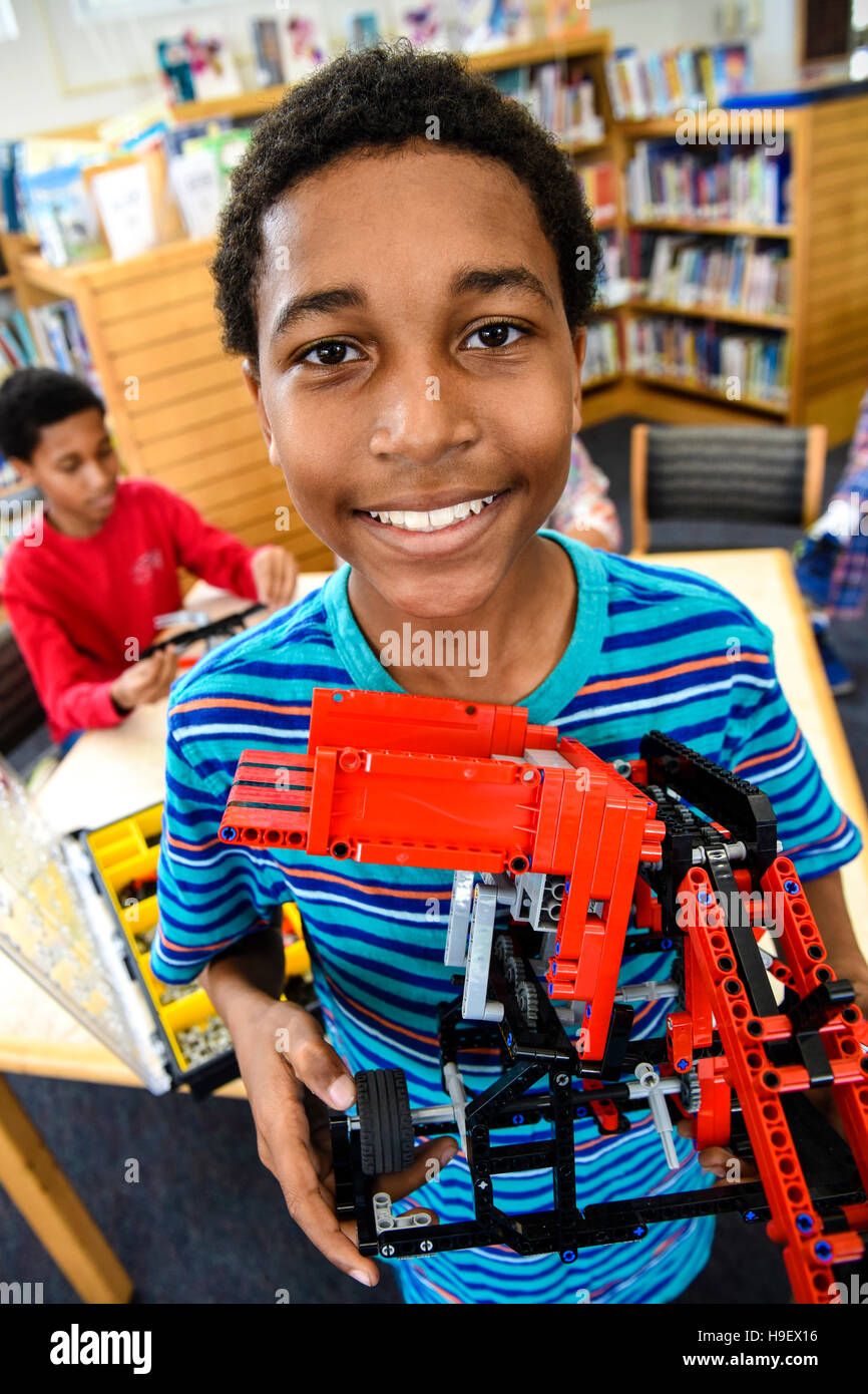 Boy standing in front of block hi-res stock photography and images - Alamy