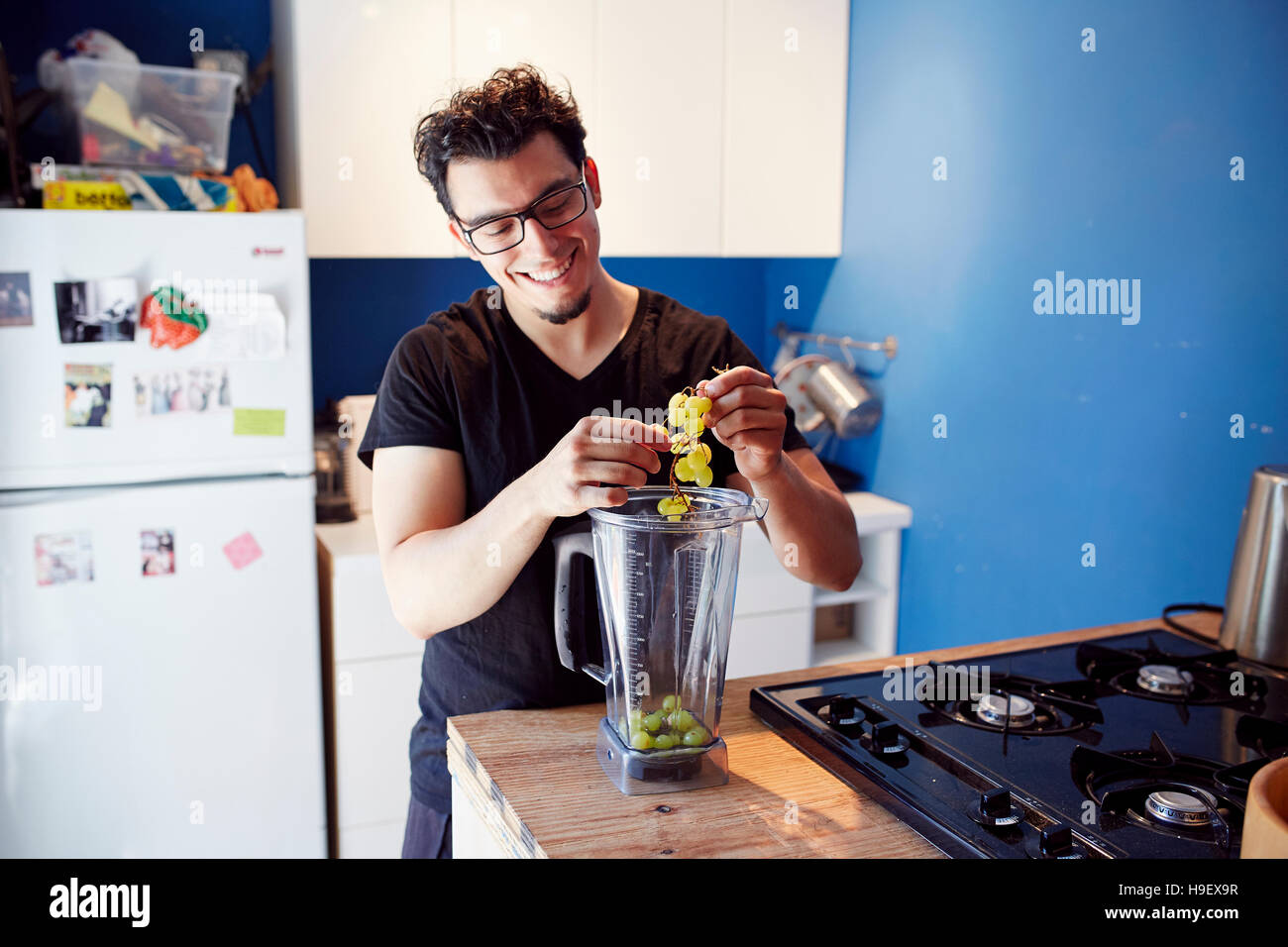 Hispanic man smiling inside new hi-res stock photography and images - Alamy