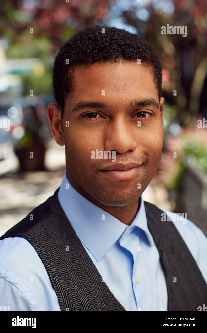Confident man wearing vest outdoors Stock Photo - Alamy