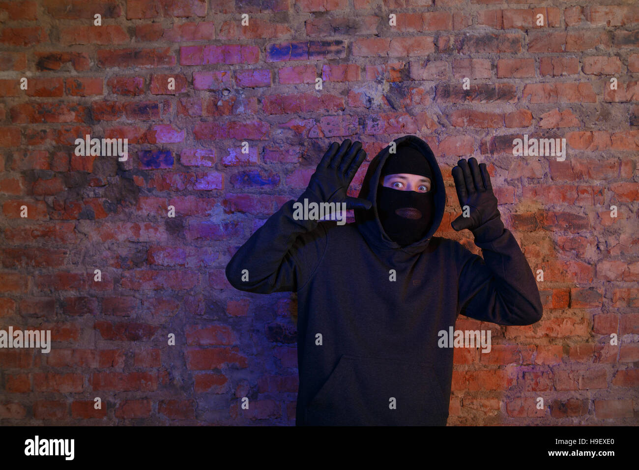 Burglar in wall at night Stock Photo - Alamy