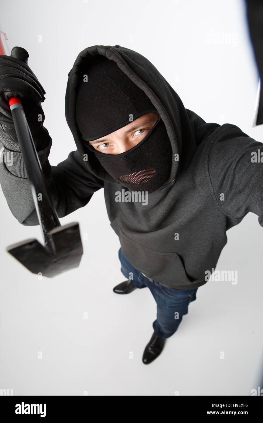 Robber peeps with master key Stock Photo - Alamy