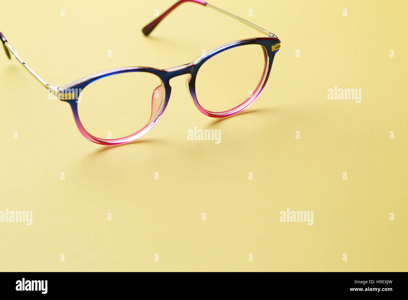 Multi-colored glasses on empty space Stock Photo - Alamy