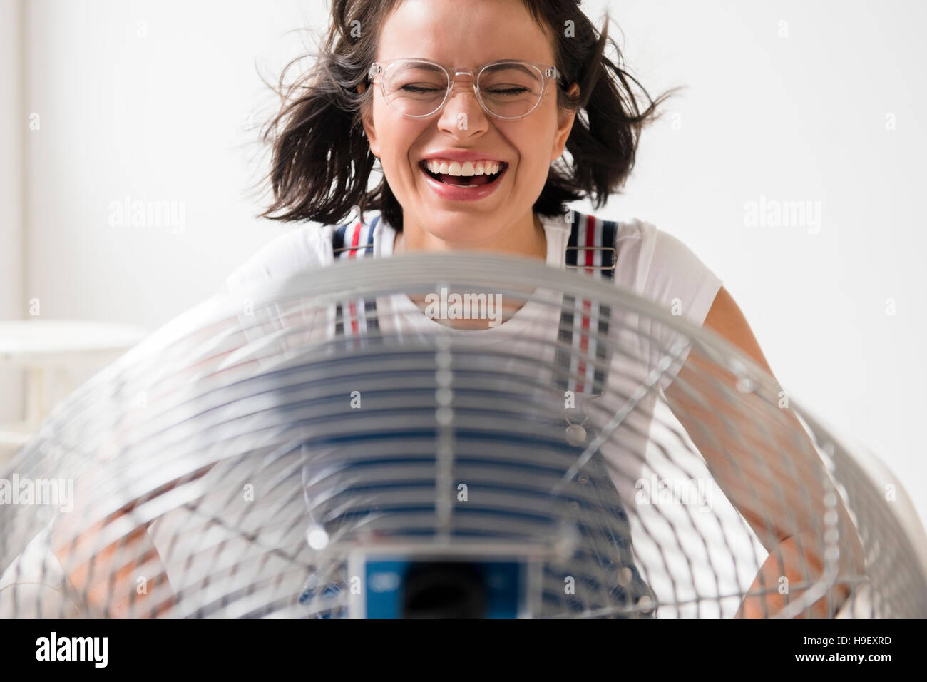 Woman blowing wind humour hi-res stock photography and images - Alamy