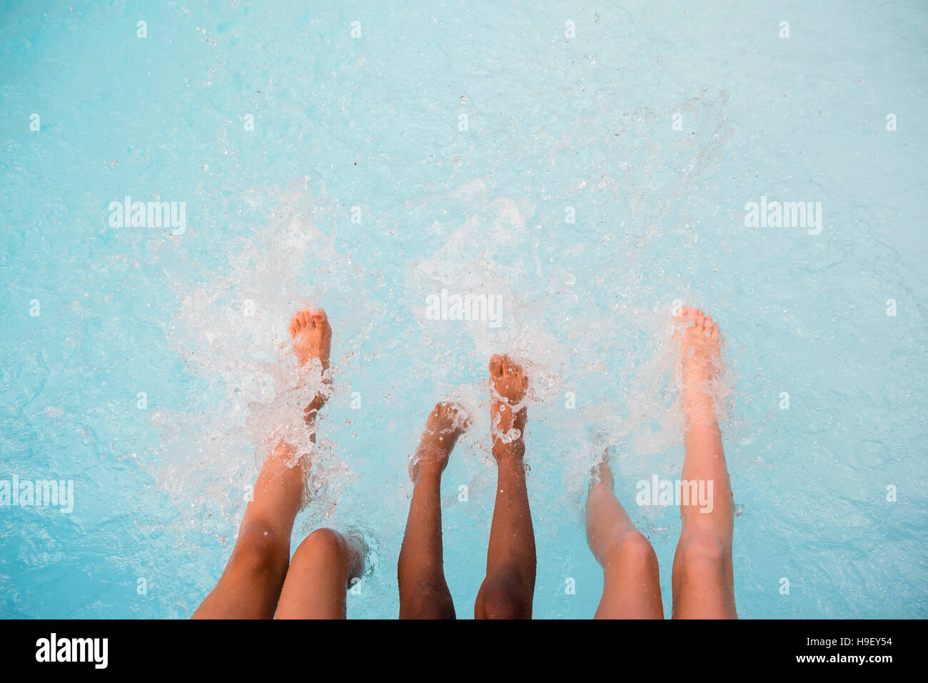 Legs kicking in pool hi-res stock photography and images - Alamy