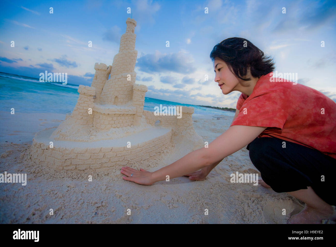 Building sandcastle mature woman hi-res stock photography and images ...