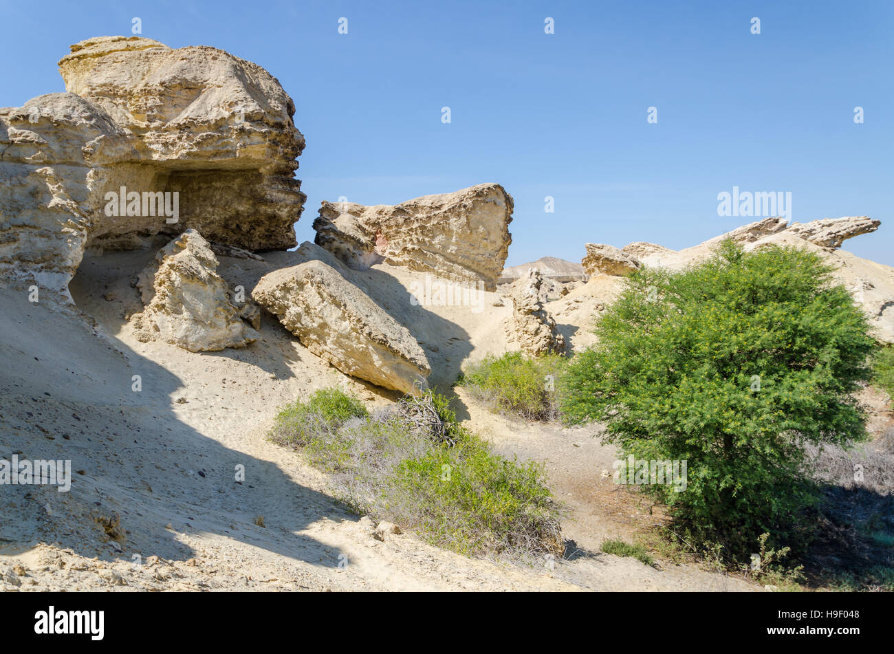 Natural rock formations and sparse vegetation at Lake Arco in Angola's ...